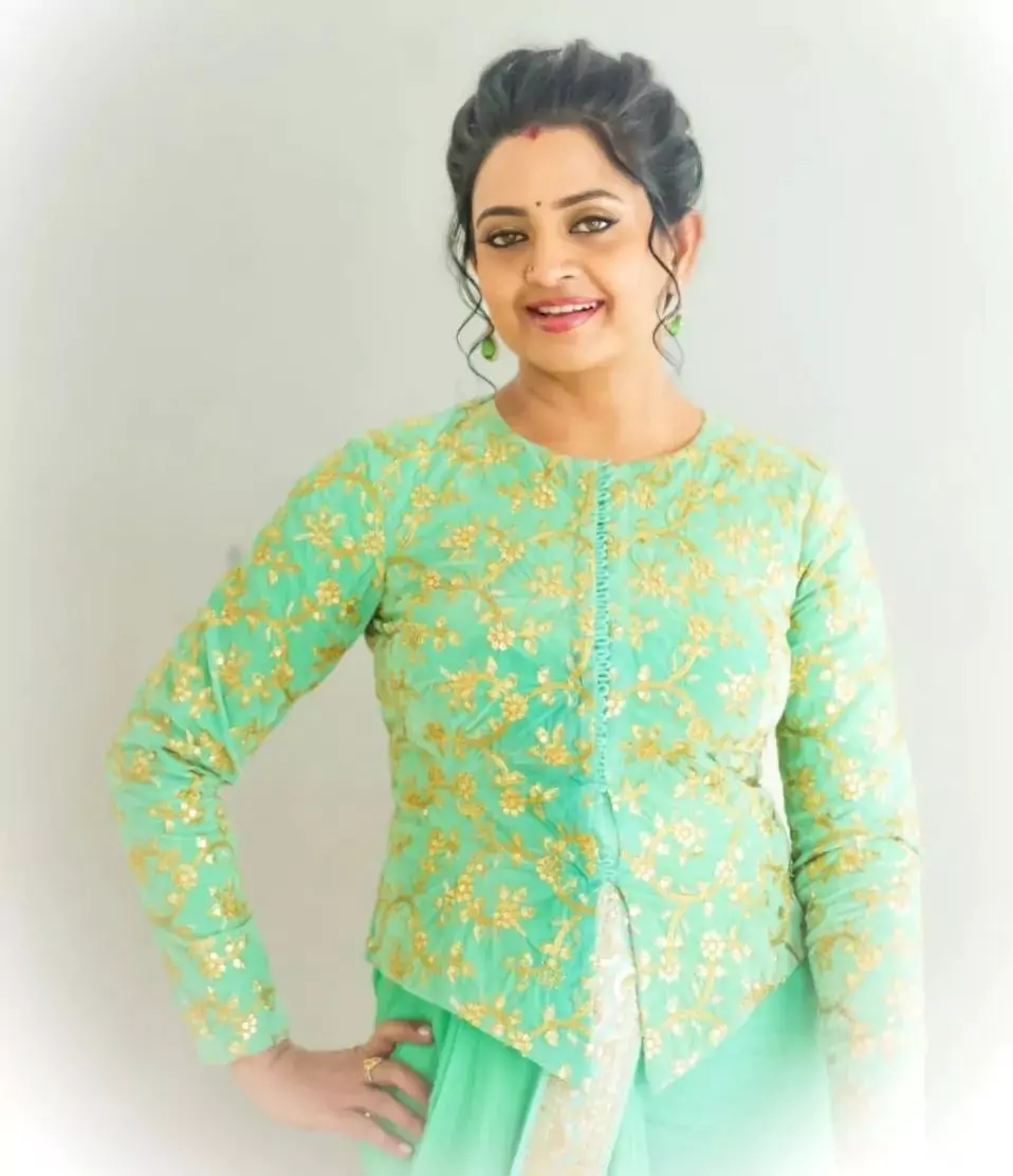 Indraja's Green Saree and Blazer-Style Blouse Ensemble