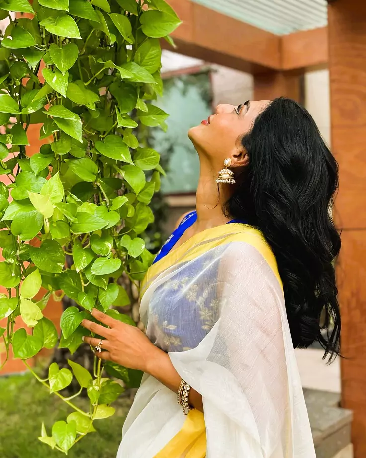 A Vision in White & Blue: Aishwarya Lakshmi's Captivating Saree..